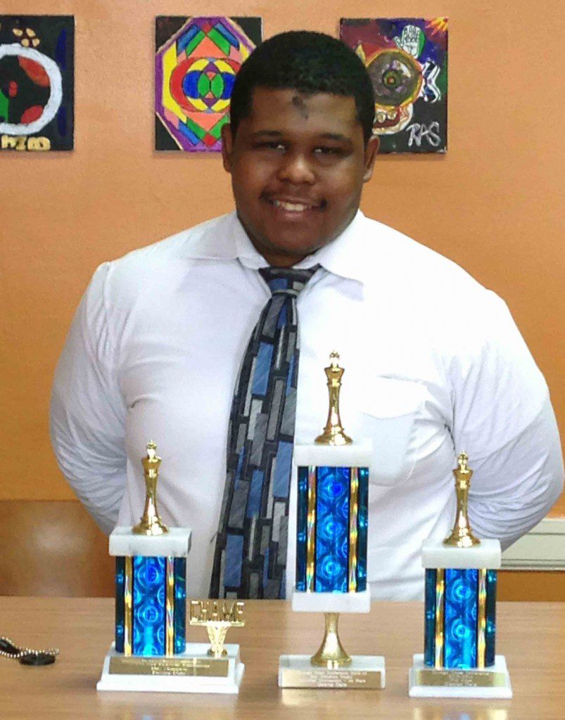 Junior Dexter Dale collects three trophies at the Chicagoland Chess ...